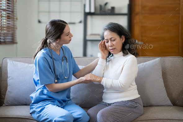 Female doctor holding female patient hands with compassion and comfort ...