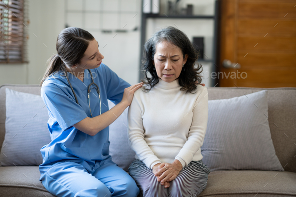 Female doctor holding female patient hands with compassion and comfort ...