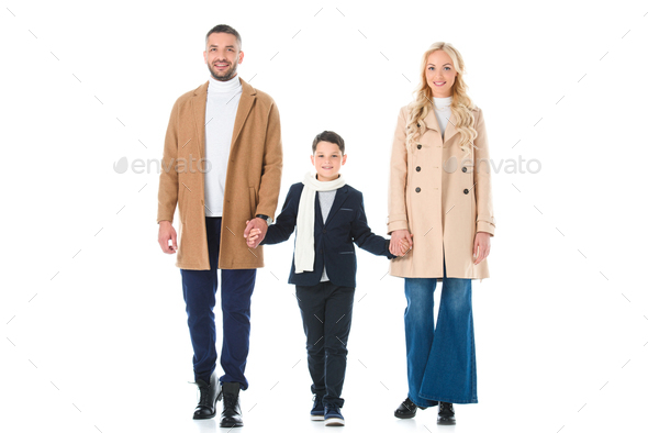 parents in beige coats and son holding hands, isolated on white Stock ...