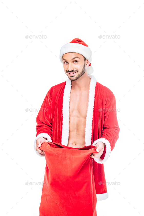 smiling muscular man in santa claus costume with christmas sack ...
