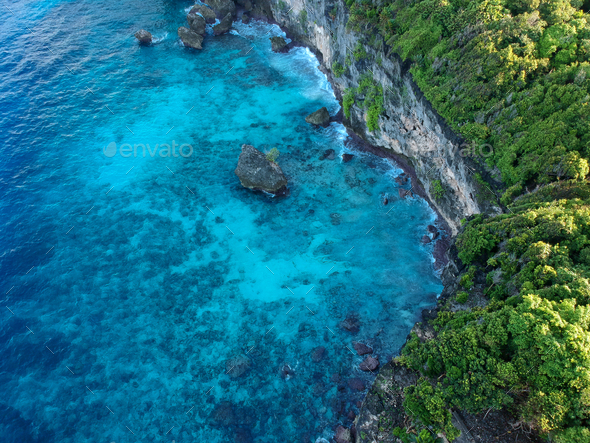 Aerial view Top down seashore. Waves crashing on rock cliff. Stock ...