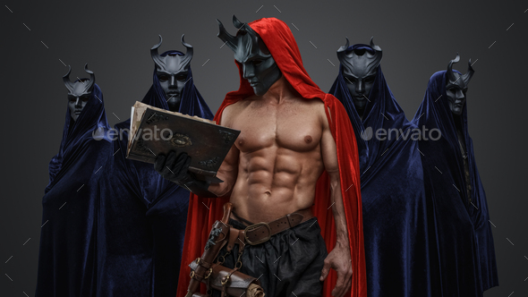 Five cultists with horned masks and dark robes Stock Photo by fxquadro
