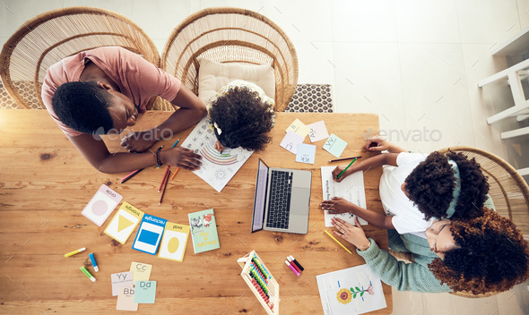 Elearning, eduction and homework with black family at table from top ...