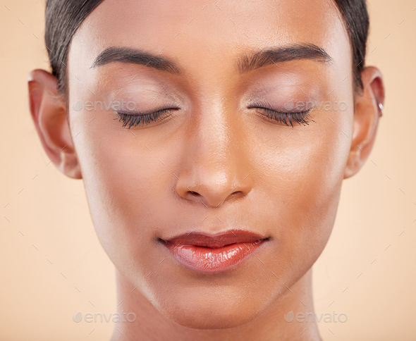 Face, eyes closed or make up on model woman in studio isolated on beige ...