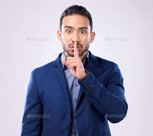 Portrait, corporate man and finger on lips in studio, background and ...