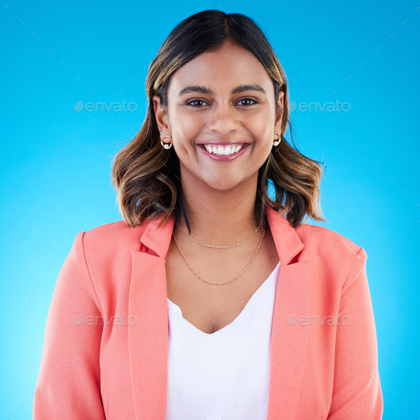 Smile, portrait and business woman in studio isolated on a blue ...