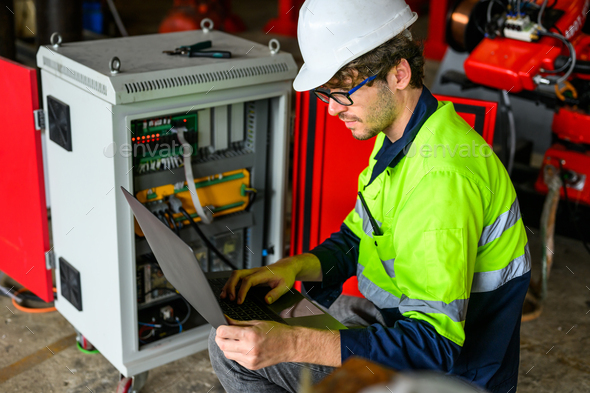 Engineer foreman checking and inspecting machine at industrial factory ...