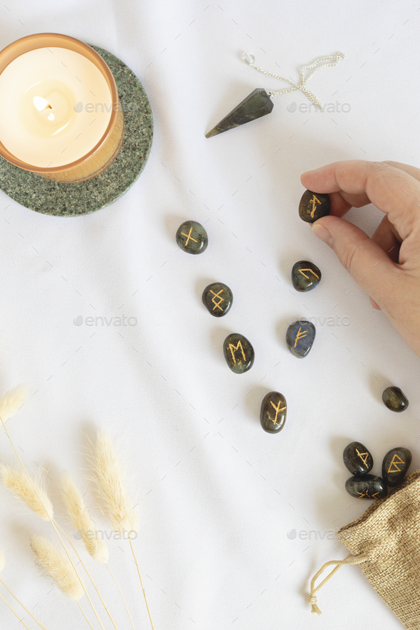 Set of rune stones for divination and fortune telling Stock Photo by OksaLy