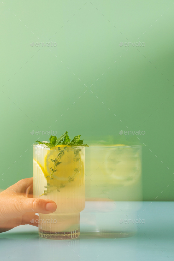 Lemonade with fresh lemon slices in a glass in the photo with a ...