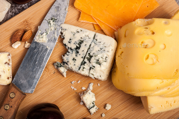 Healthy snaks from different type of cheese, nuts and plums Stock Photo ...