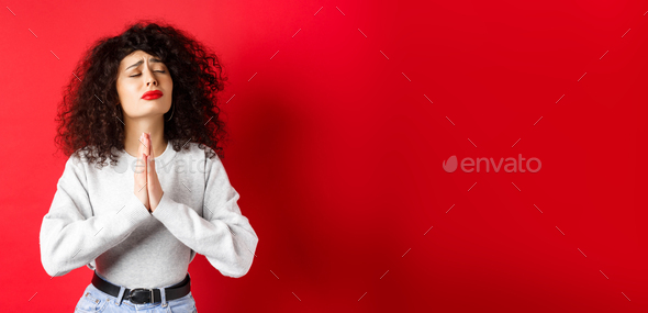 Desperate young woman pleading God, making wish and supplicating ...