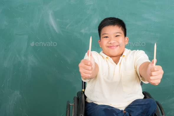 Young Asian disabled child student on wheelchair in happy and smile ...