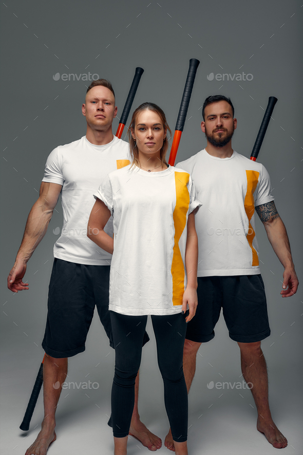 People stand together and practice sticks. Karate masters posing with ...