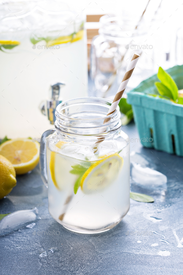 Fresh citrus lemonade in beverage dispenser Stock Photo by fahrwasser