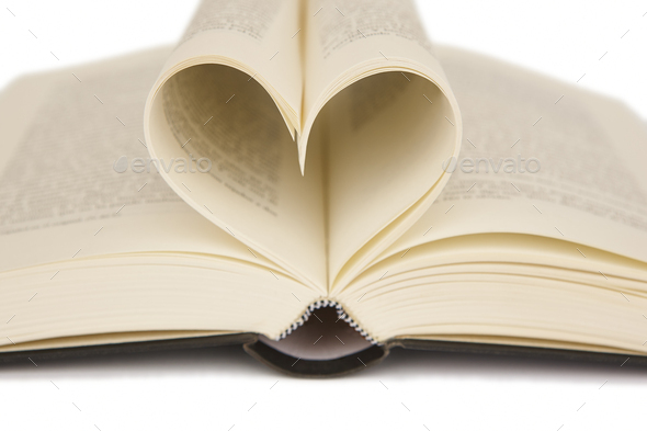 Open book with heart shaped pages. Love for reading Stock Photo by ABBPhoto
