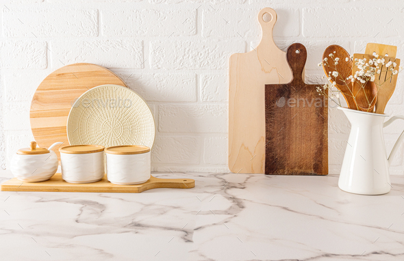 eco-friendly kitchen items on the kitchen countertop against the white ...