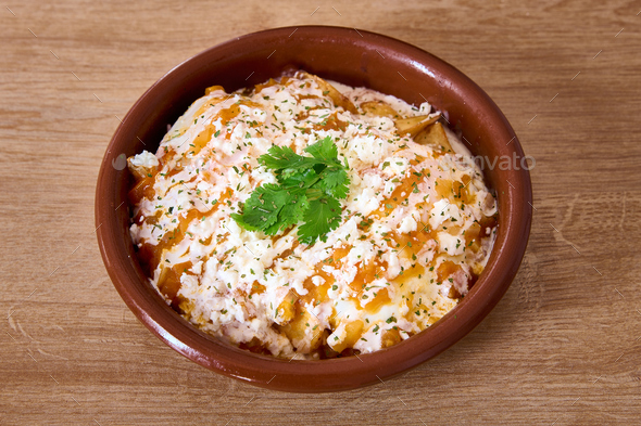 dish of shredded meat, pickled onion, nachos and lime. Typical Mexican ...