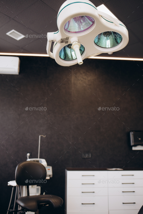 light with dental chair white color blur background Stock Photo by ...