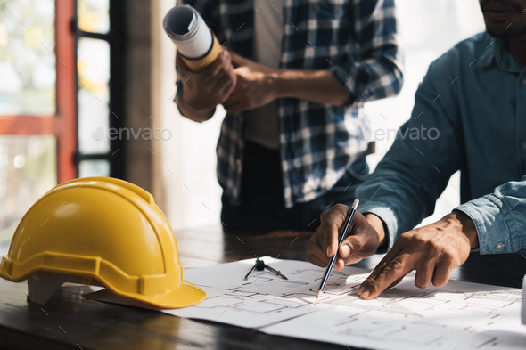 Close up view of Architect sketching a construction project on his ...