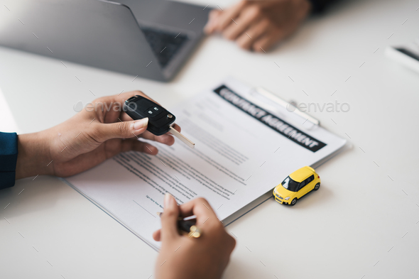 Car agent, sale man explain terms and agreement to customer before ...