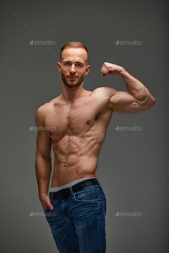 Portrait of a handsome young guy model a shirtless with a muscular ...