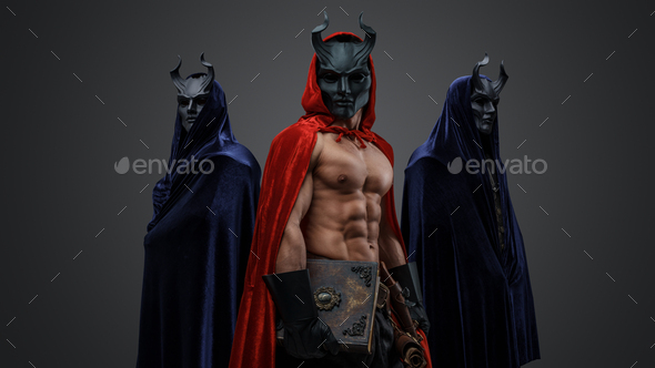 Three evil cultists with cloaks and horned masks Stock Photo by fxquadro