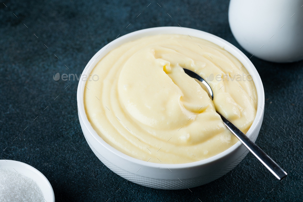 Glass jar with vanilla pudding. Custard cream. Traditional cream Stock ...
