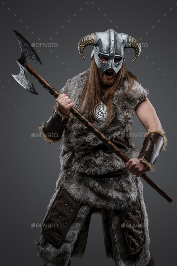 Violent viking with huge axe against grey background Stock Photo by fxquadro