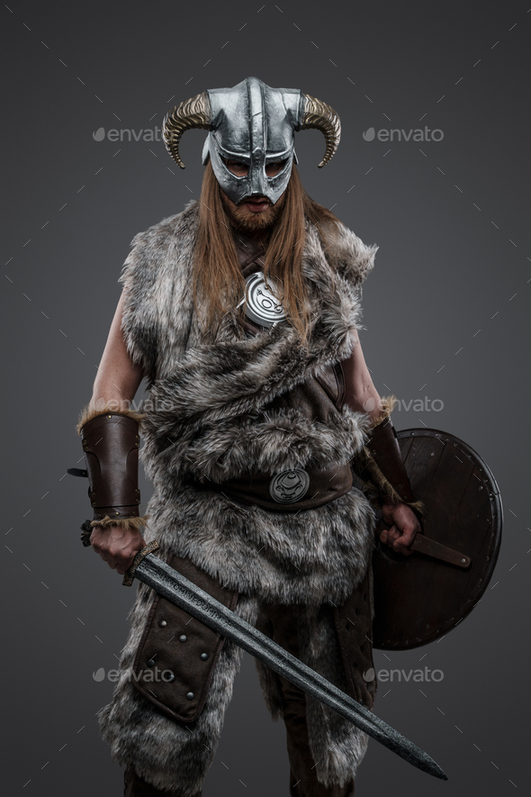 Long haired viking from past with shield and sword Stock Photo by fxquadro
