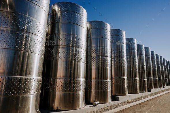 Steel modern cisterns for wine production on plant territory. Large ...