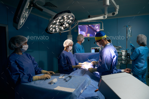 Surgeon operates on a patient in a modern operating room Stock Photo by ...