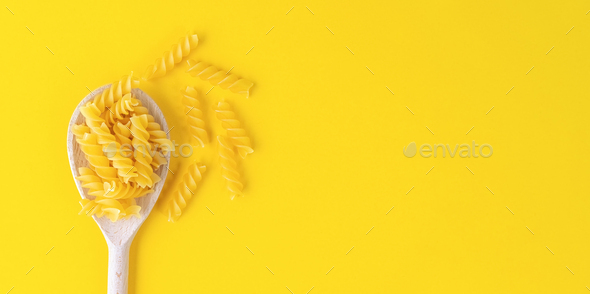 Raw pasta fusilli spaghetti pattern. Food background, italian cuisine ...