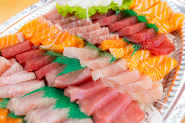 Variety of sashimi in plastic box Stock Photo by leungchopan | PhotoDune