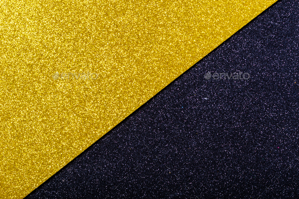 Yellow and black wrapping paper background with a metallic sheen ...