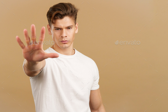 Handsome man gesturing stop with the palm of the hand Stock Photo by ...