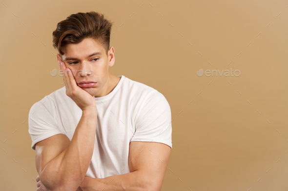 Bored caucasian man with the hand on the face Stock Photo by ivanmorenosl