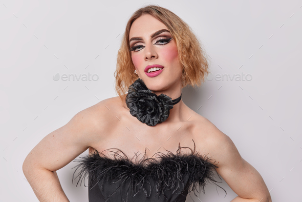 Indoor shot of transgender man poses with self confident expression ...