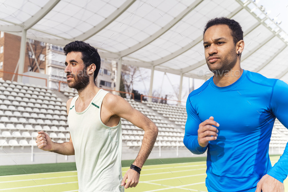 Front View of Two Athletes Running Stock Photo by nunezimage | PhotoDune