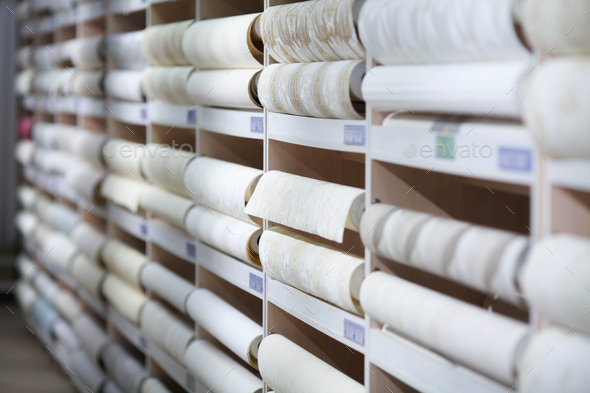 Wall-papers is in a shop. Samples of different wallpapers on store ...