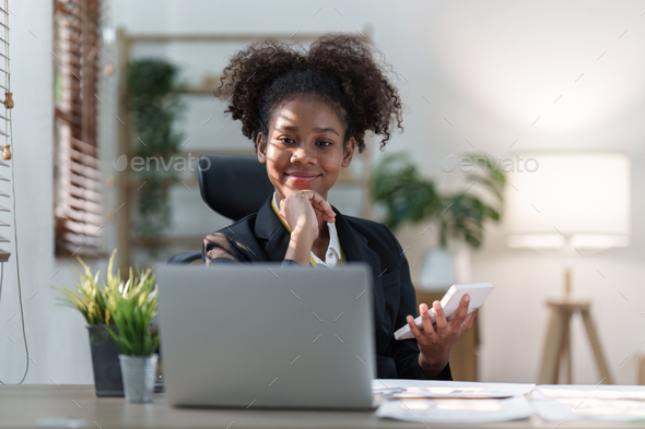 Accountant black woman working on laptop and do document, tax, exchange ...