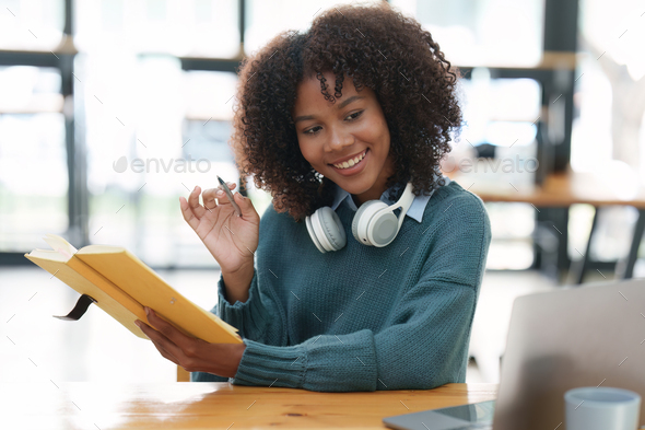Young black African woman university student learning online using ...