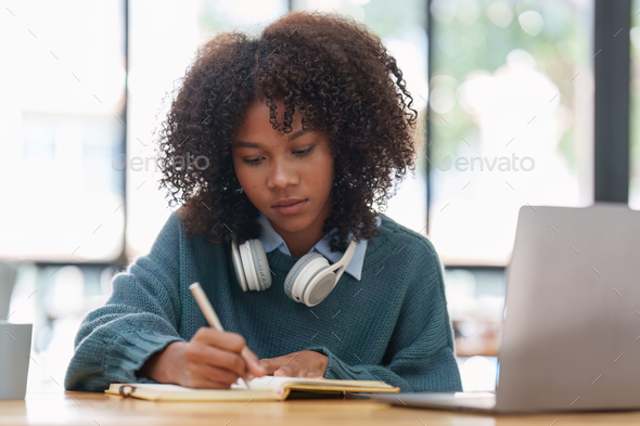 Young black African woman university student learning online using ...