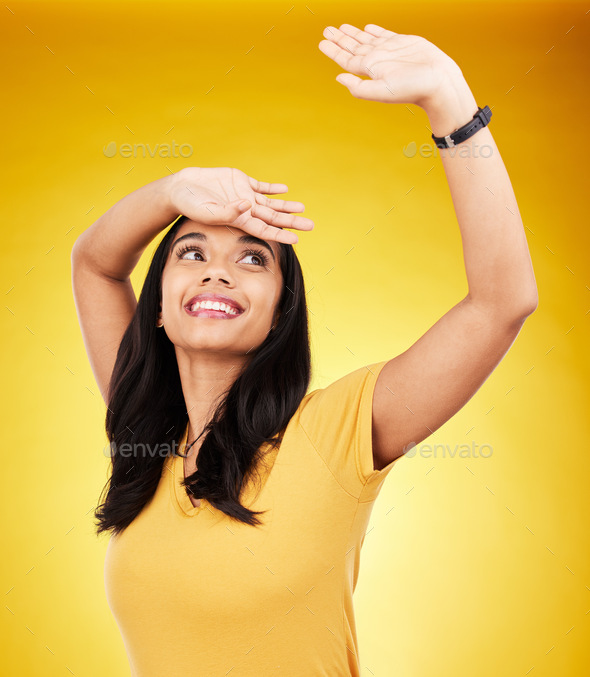 Freedom, happy and dance with a woman on a yellow background in studio ...