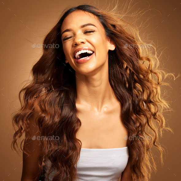 Freedom, hair and excitement with a model woman on a brown background ...
