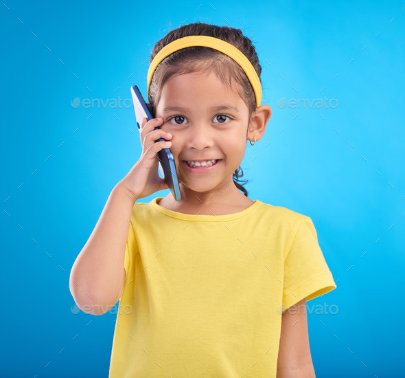 Phone call, smile and portrait of child on blue background for talking ...