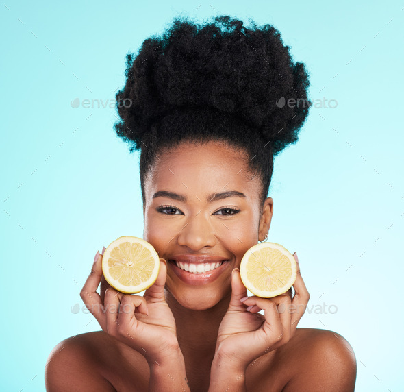 Lemon, portrait and beauty of happy black woman in studio, blue ...