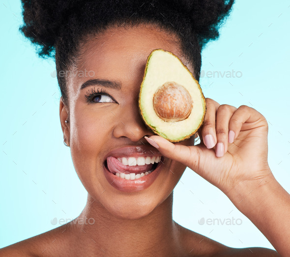 Avocado, woman and happy face of a young model with skincare, fruit and ...