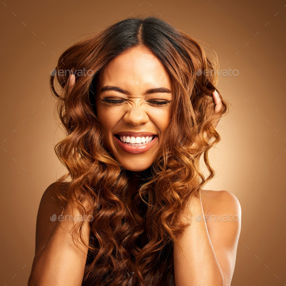 Shampoo, hair and excitement with a model woman on a brown background ...