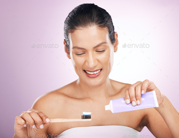 Smile, woman and bamboo toothbrush and toothpaste in studio isolated on ...
