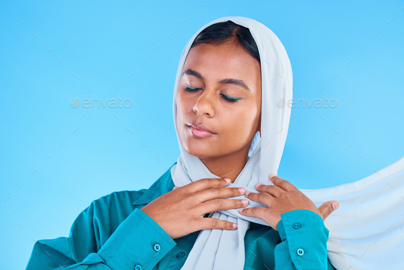 Calm woman, muslim and beauty of hijab in studio, blue background or ...